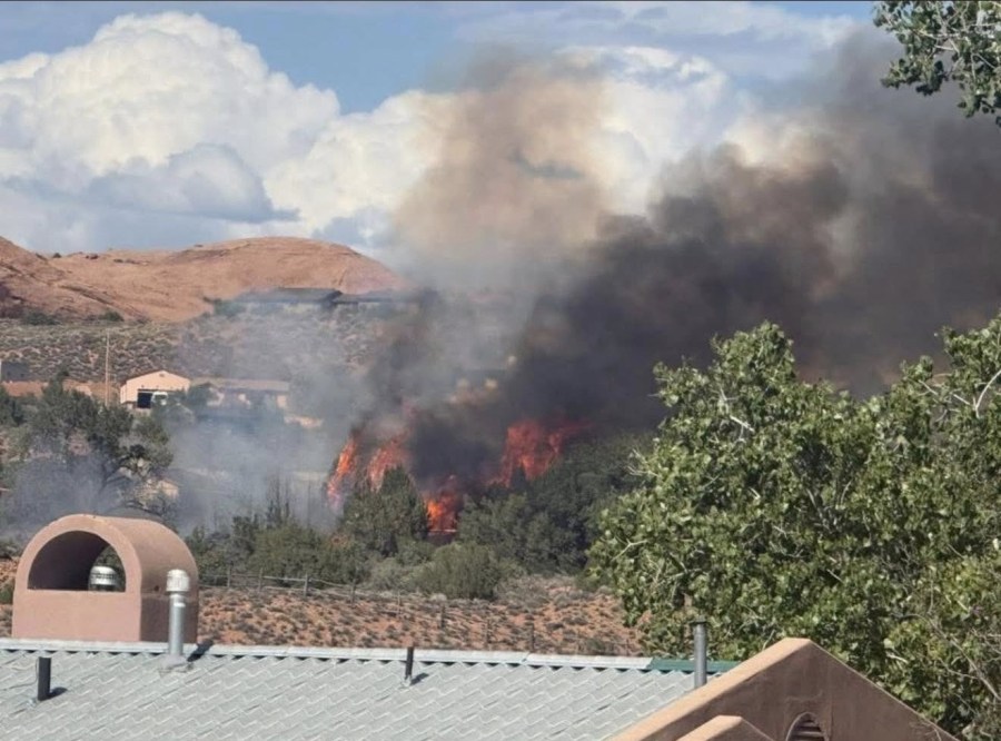 Photos: Crews extinguish brush fire that spread to home in Moab