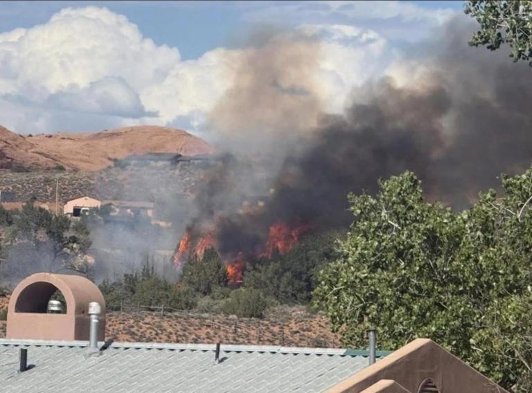Photos: Crews extinguish brush fire that spread to home in Moab