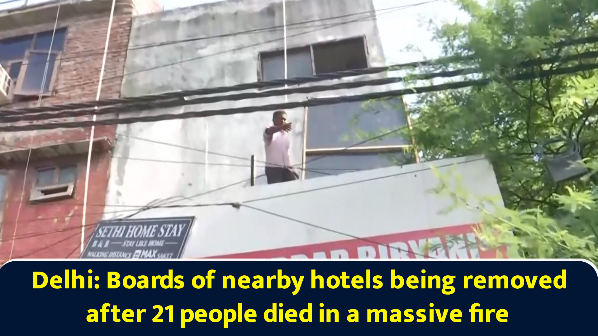 Delhi: Boards of nearby hotels being removed after 21 people died in a ...