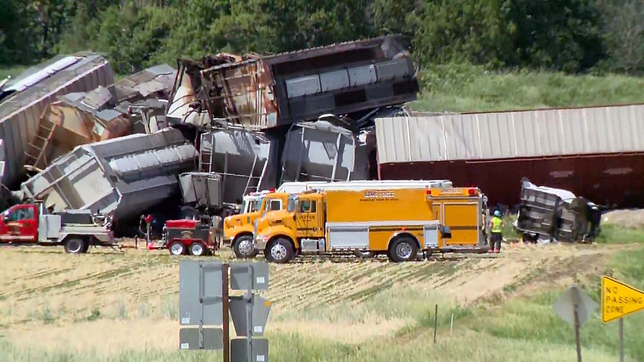 Freight train slams into semi-truck in Iowa, killing one and derailing ...
