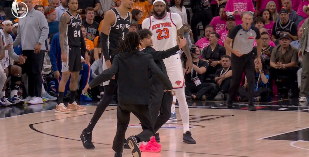 Selfie-taking fan storms court in surreal NBA Finals Game 1 scene