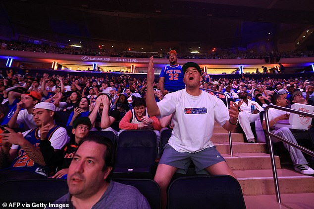 Knicks fans climb street poles and an ambulance to celebrate Game 1 ...