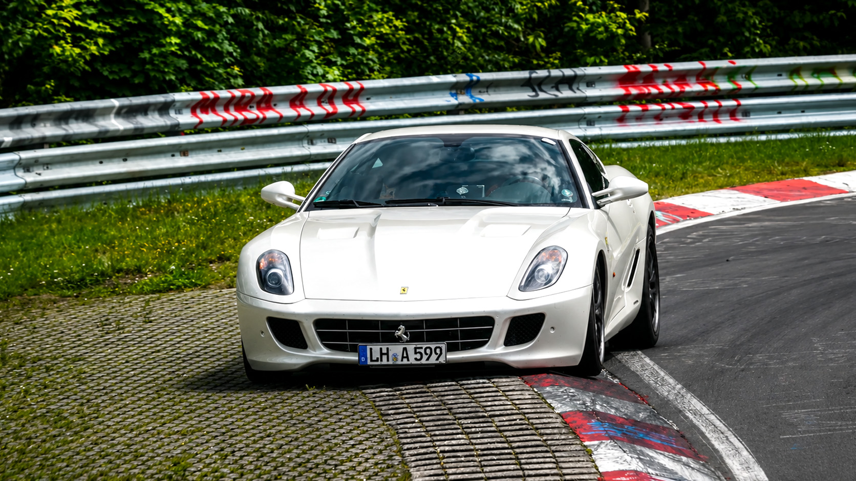 Ferrari runs wide during a Nürburgring track session