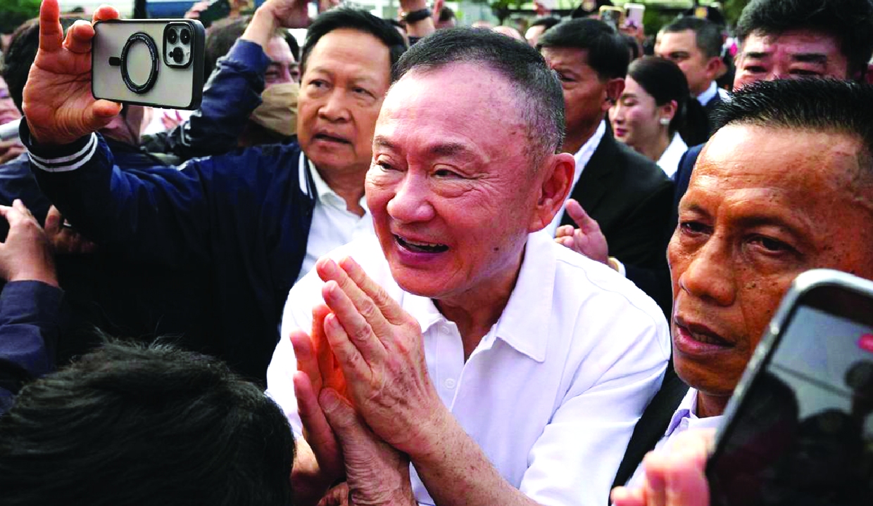 Former Thai PM freed early from parole after receiving royal pardon