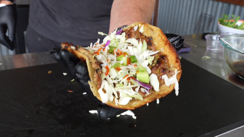 Crispy smashed dumpling tacos cooked perfectly on a Blackstone
