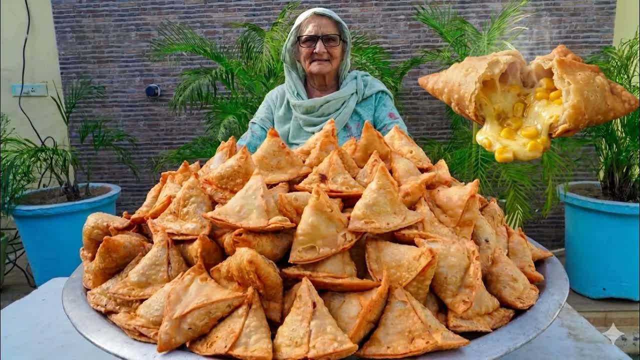 Cooking over 100 cheese samosas the traditional way