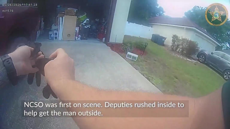 Watch: Nassau County deputies rush into burning home to save man, dogs
