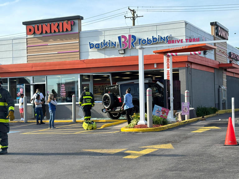 Vehicle drives into Dunkin' near prominent suburban shopping center