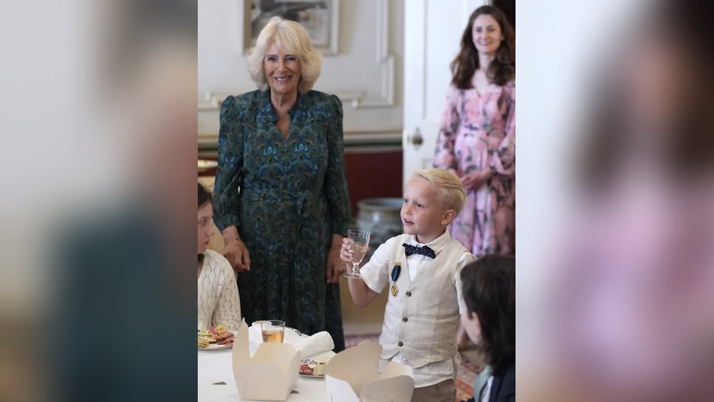 Seriously ill boy makes Queen Camilla smile with a piece of toast