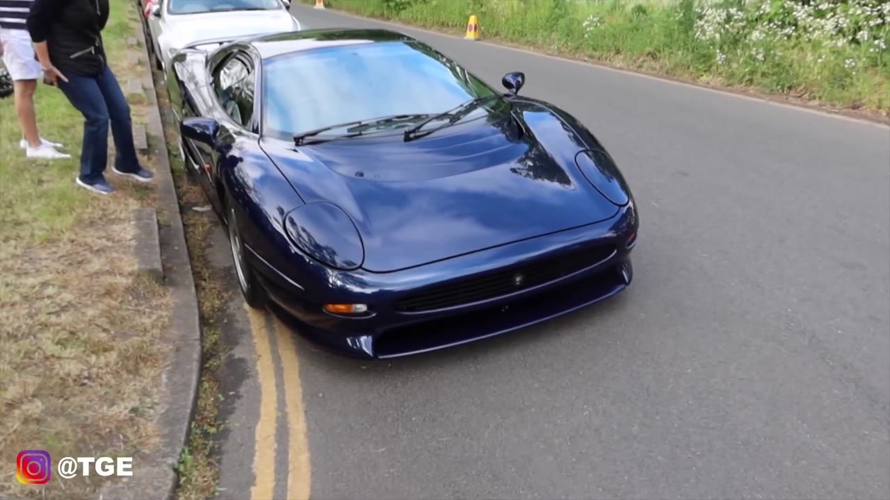 Jaguar XJ220 steals attention at a car meet packed with rare machines