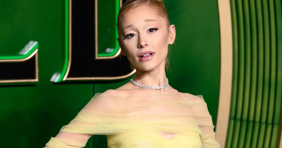 Ariana Grande layers Swarovski bling over plunging sheer micro minidress
