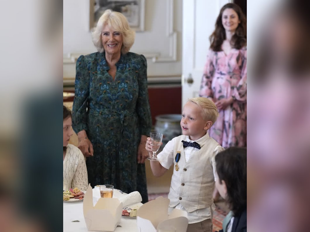 Seriously ill boy makes Queen Camilla smile with a piece of toast