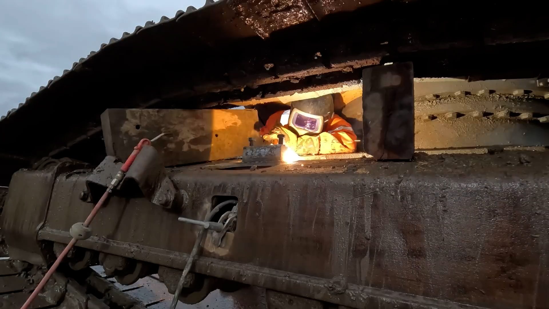 Confined-space welding repair on heavy conveyor equipment