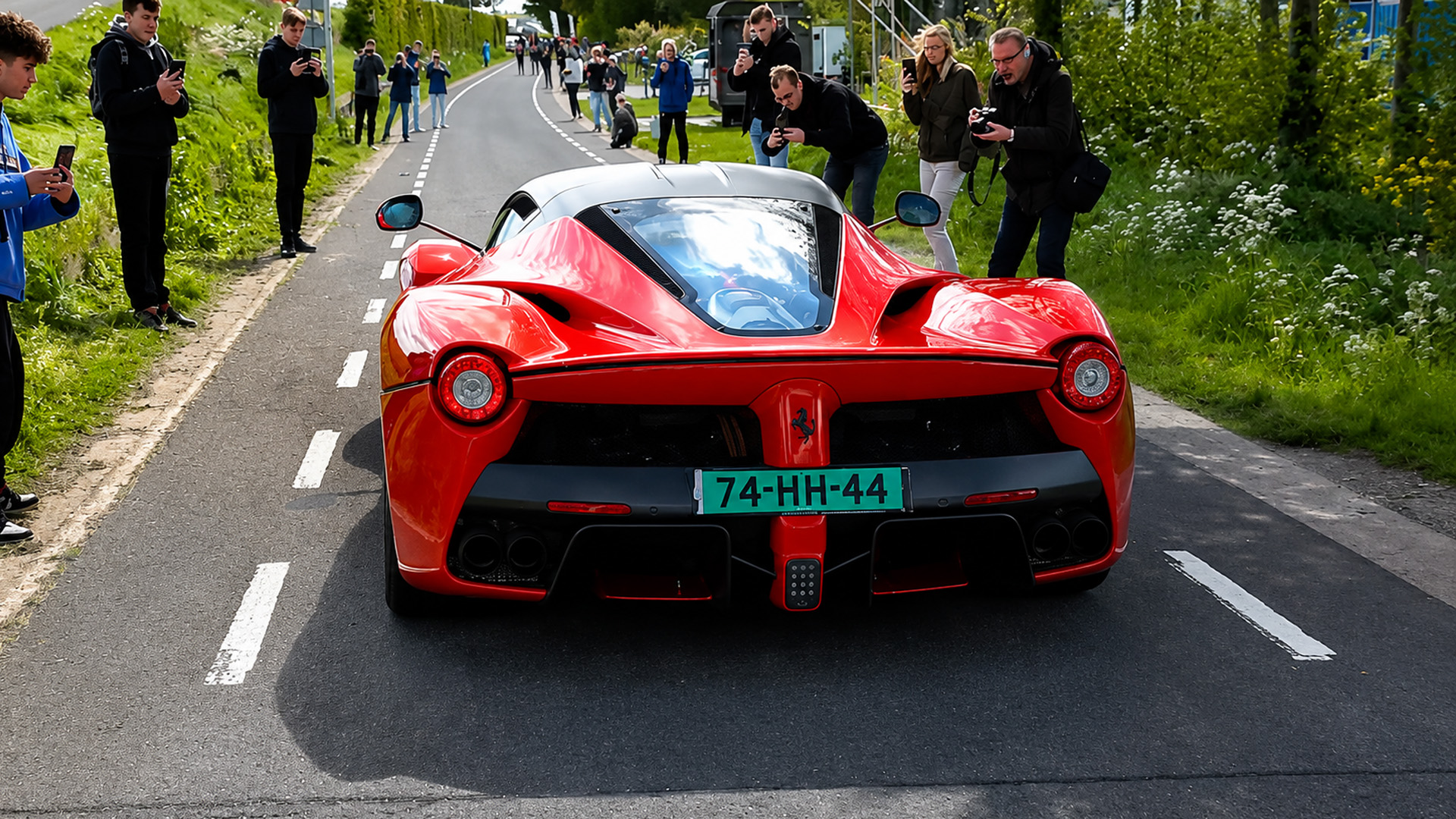 Rare Ferrari LaFerrari hard launch in front of crowd on narrow road