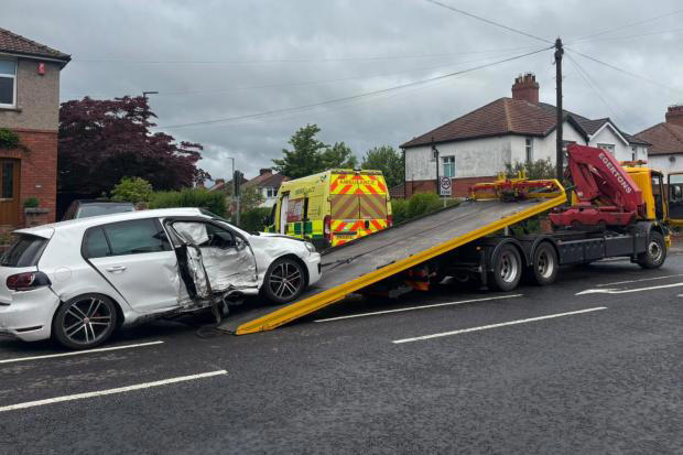Emergency services at scene after crash between car and police van