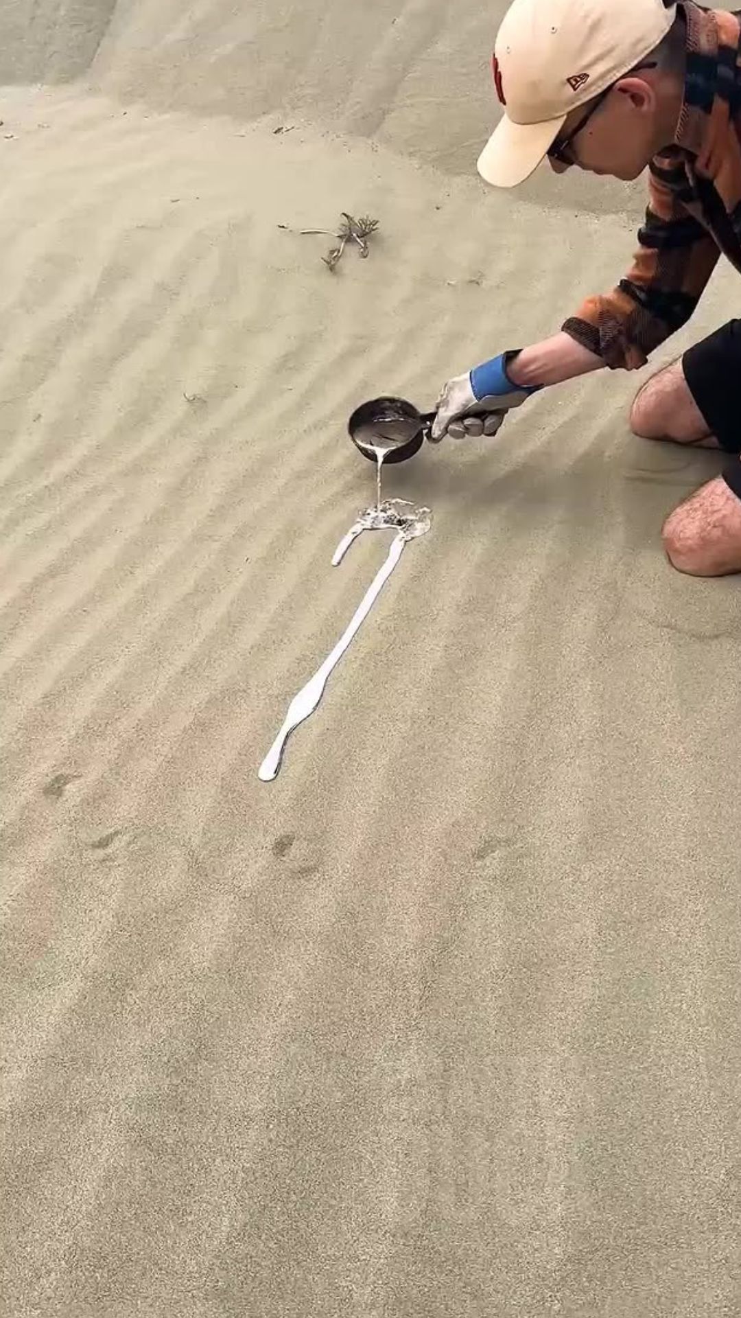 Watch what happens when molten silver hits sand