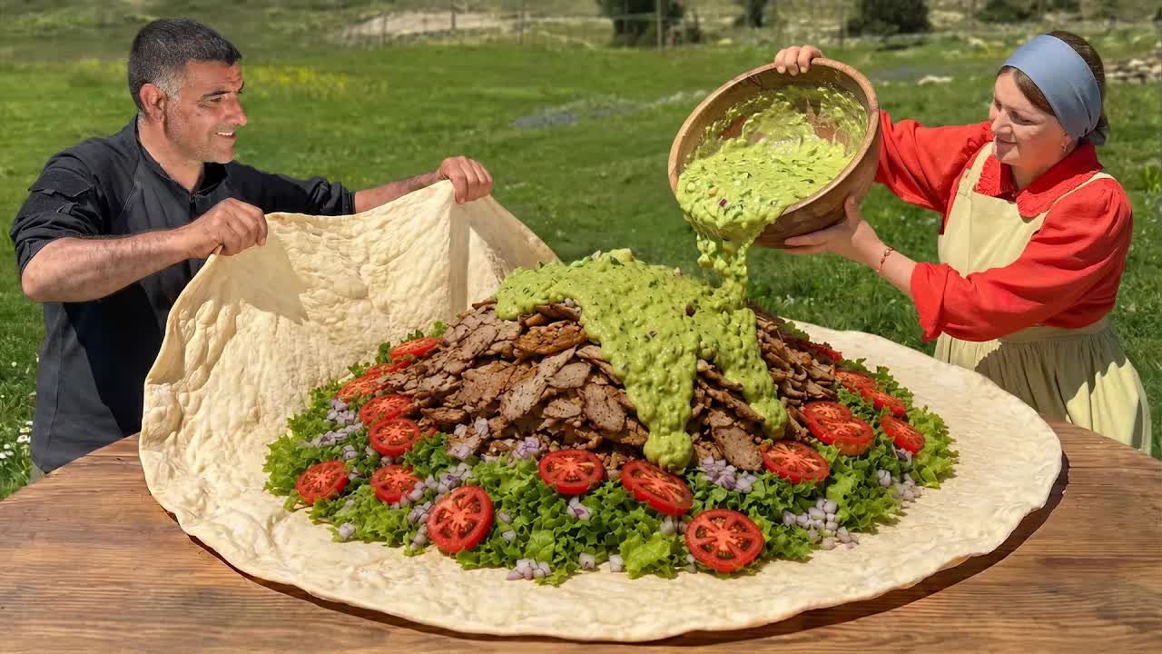 The village gathered around this giant shawarma feast