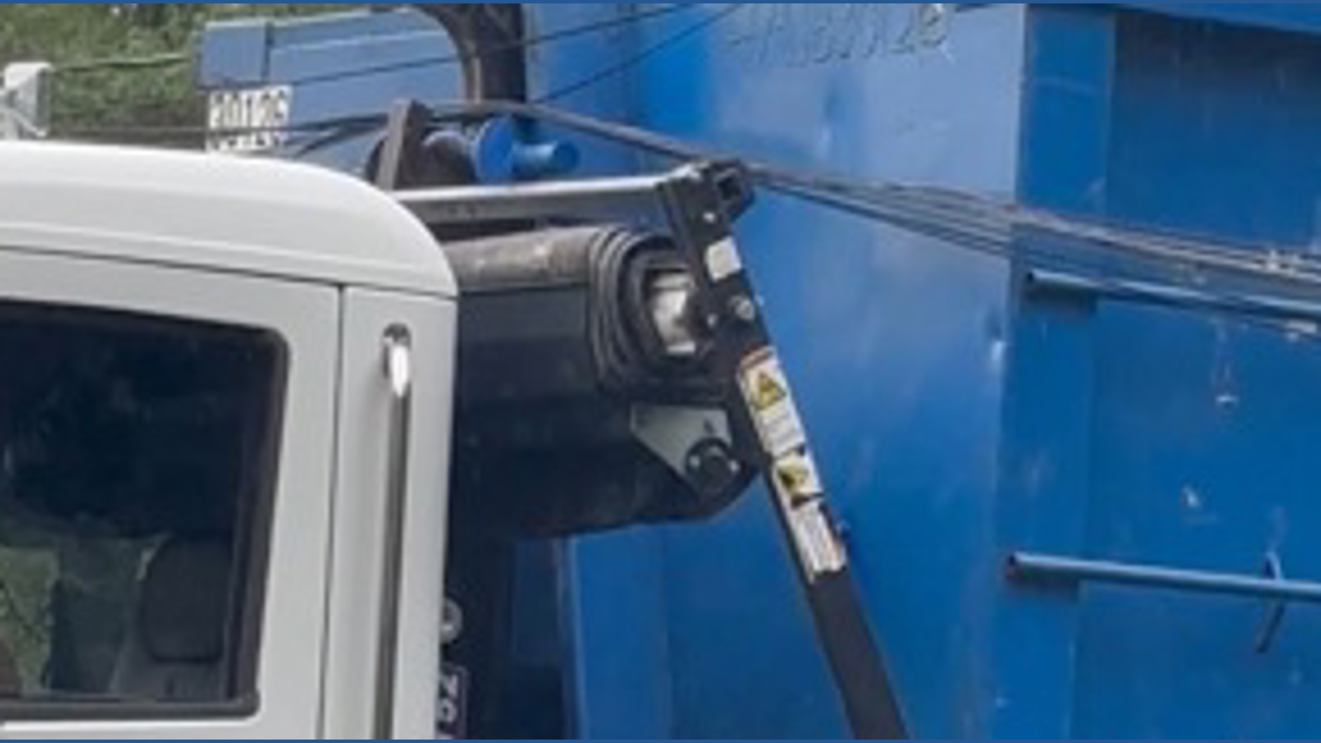 Dumpster truck hits power lines in East Austin