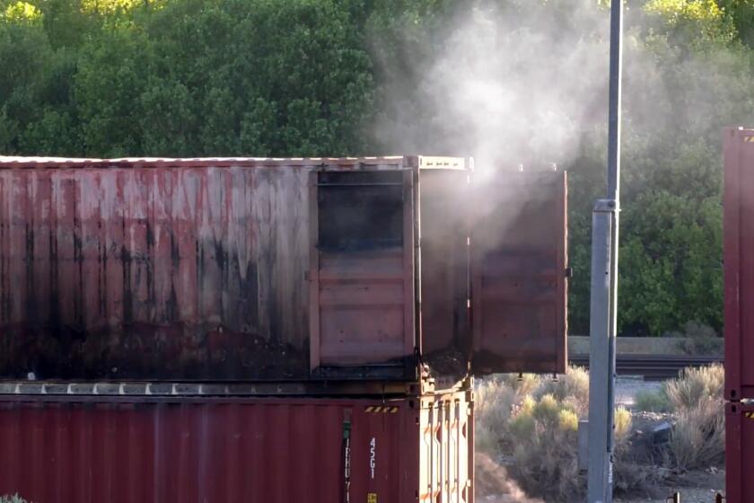 Rail car loaded with lithium batteries bursts into flames in Cajon Pass
