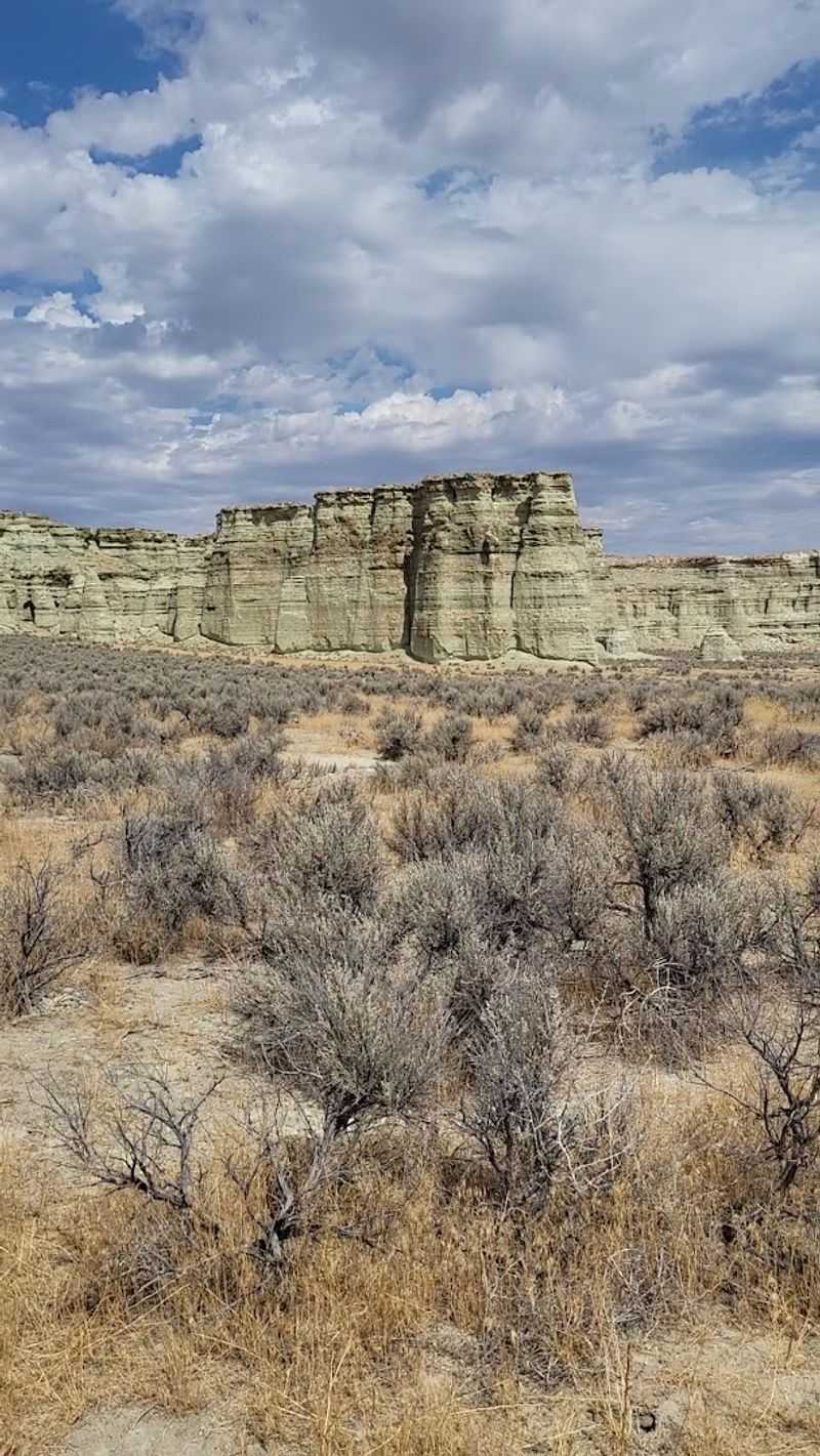 Towering 100-foot pale clay cliffs that resemble ancient Roman ruins ...