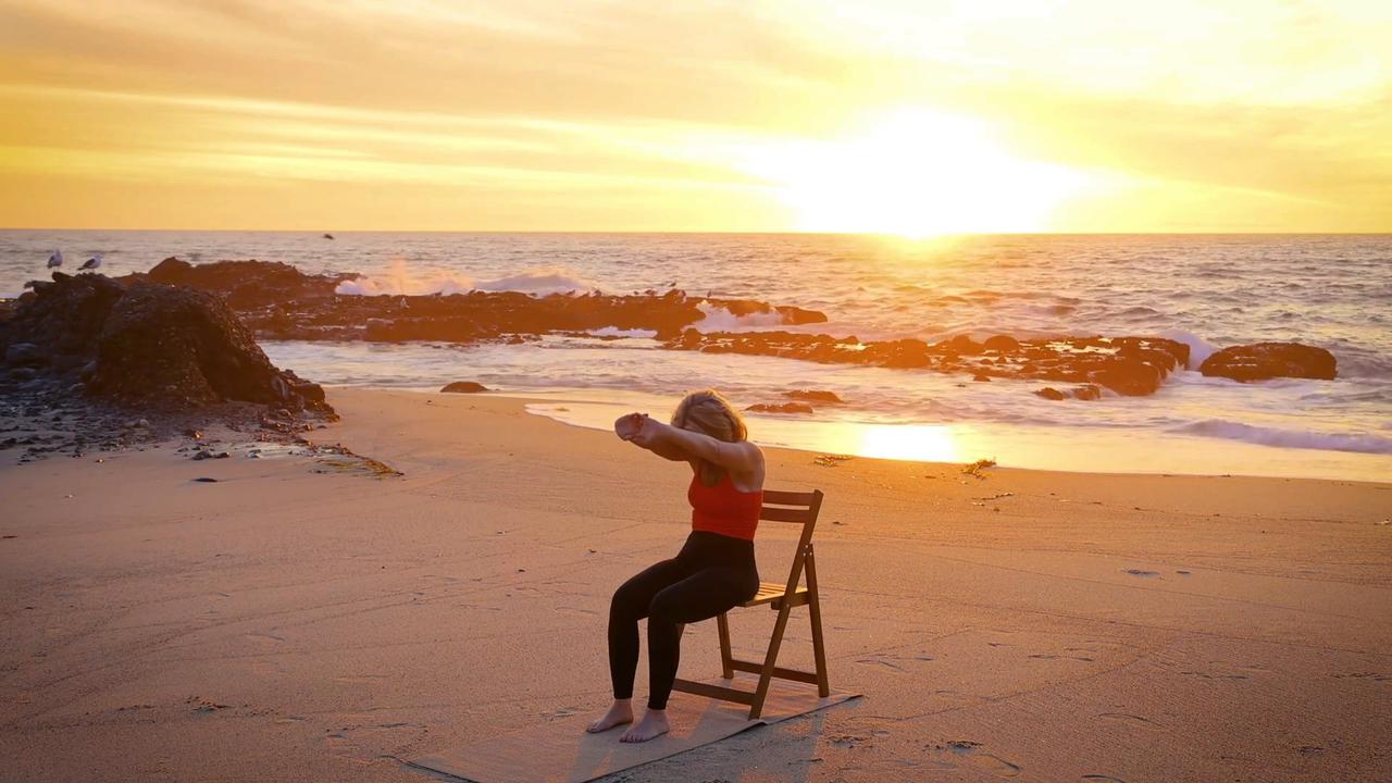 Mid-day chair yoga to release tension in your tired, tight back