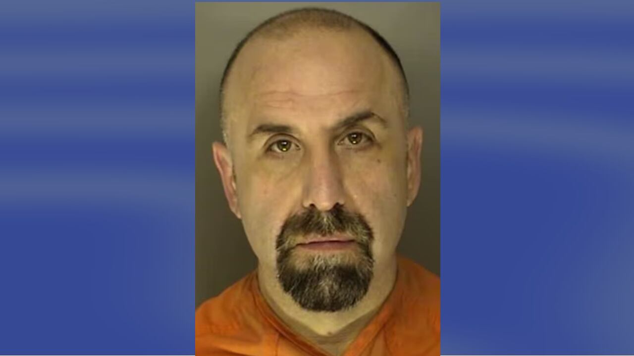 Former detective accused of pulling gun on police officer microwaving fish