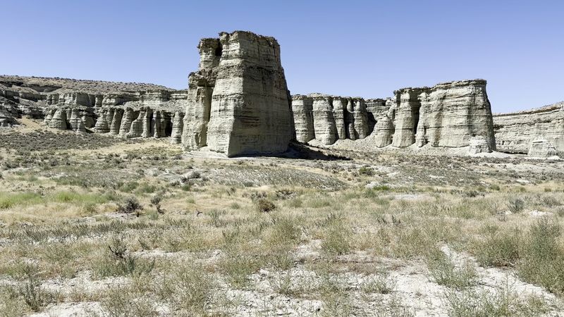 Towering 100-foot pale clay cliffs that resemble ancient Roman ruins ...
