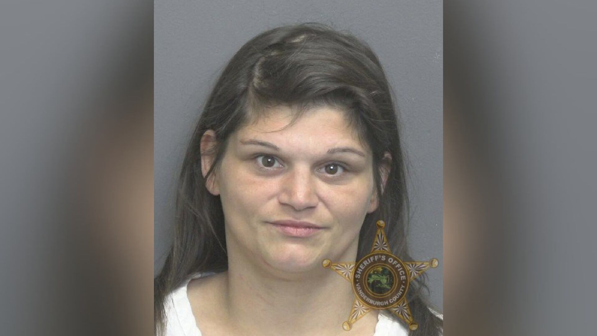 Woman spits on officer after threatening to kill her child, police say
