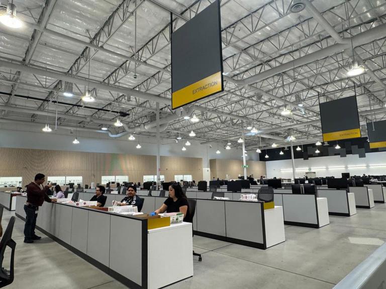 Inside LA County election vote-counting facility with rows of empty ...