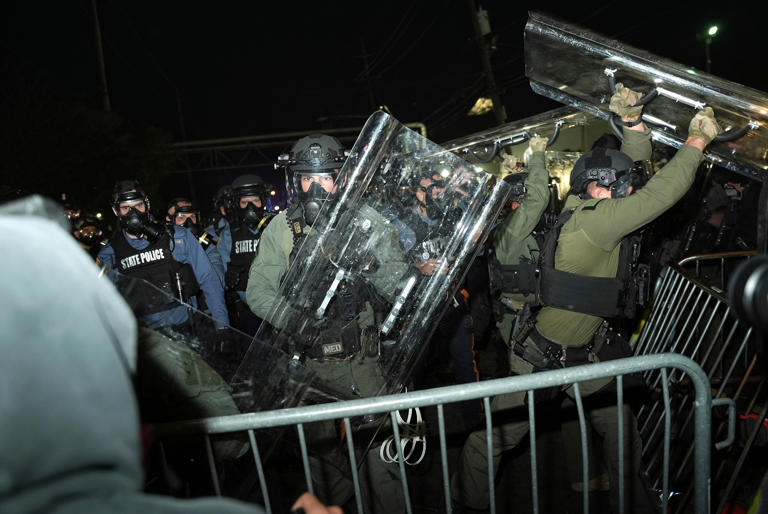 Officer charged with stealing journalist's camera bag, allegedly ...