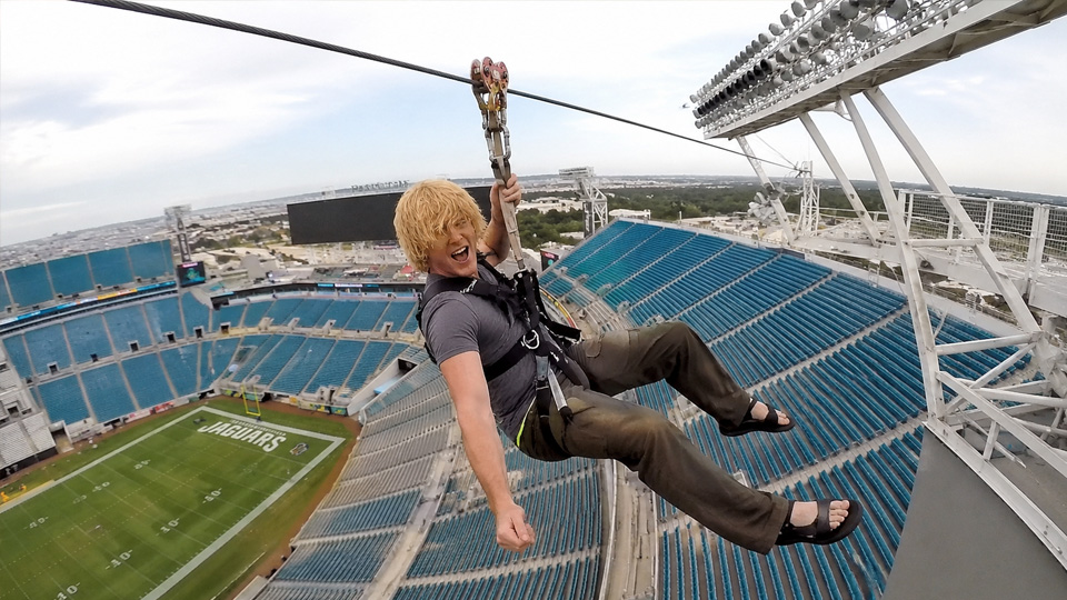 Rope swing ride flies high above football field
