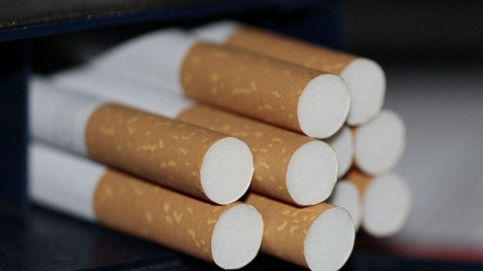 Can occasional smoking raise your health insurance premium? Here's what ...