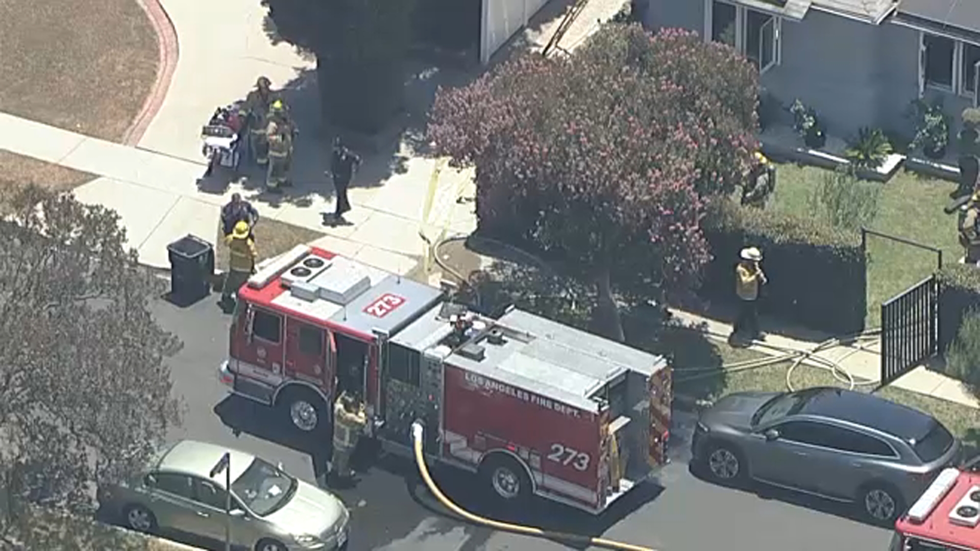 House fire near Reseda becomes crime scene after man found with a gun