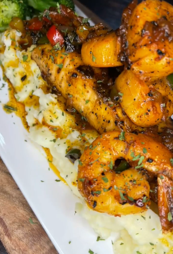 Scallops, shrimp, and salmon in honey garlic ginger butter sauce