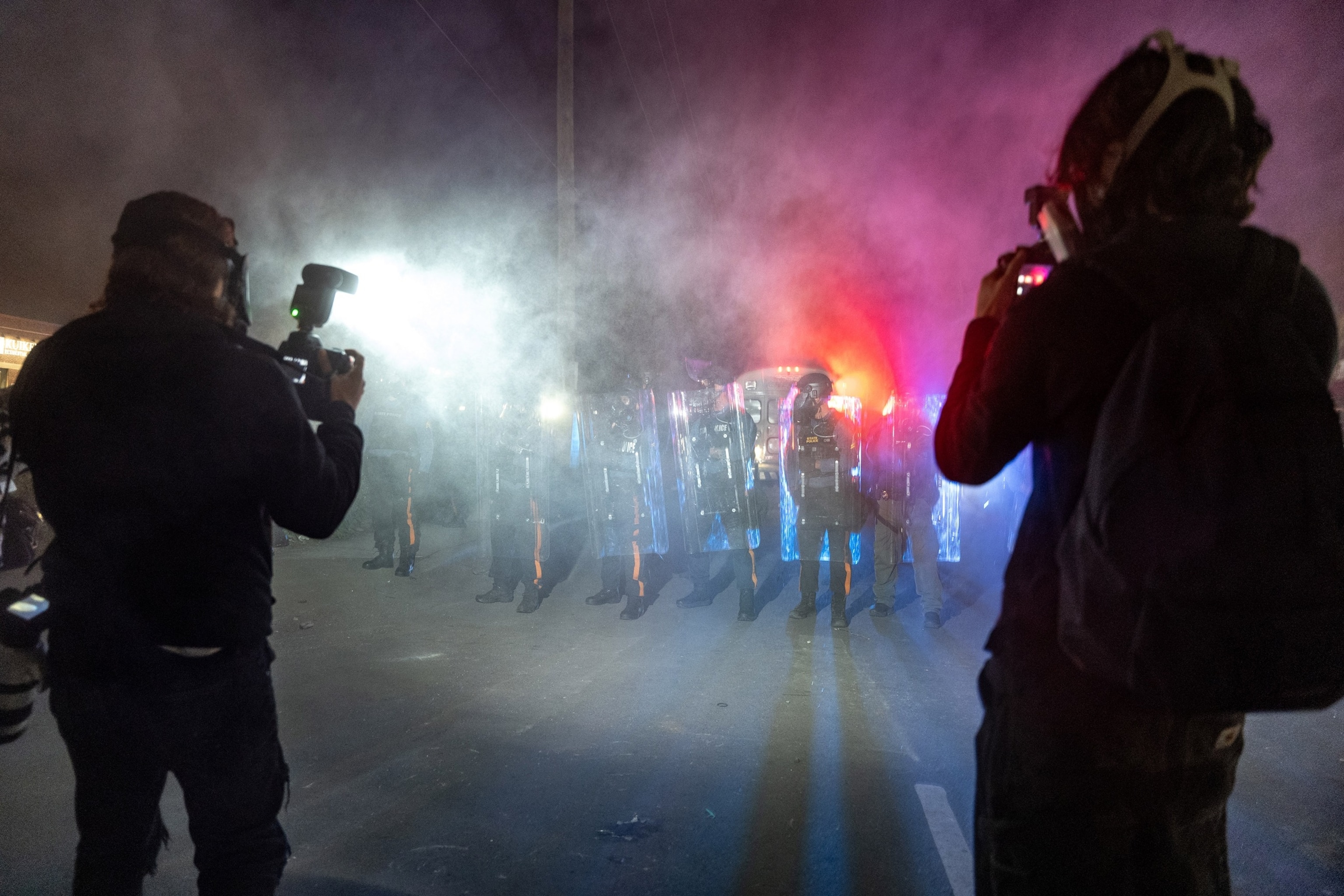 Officer charged with stealing journalist's camera bag, allegedly ...