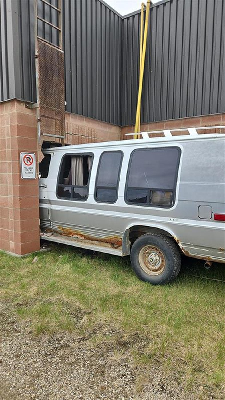 Worker trapped, hurt after van crashes into daycare near Edmonton