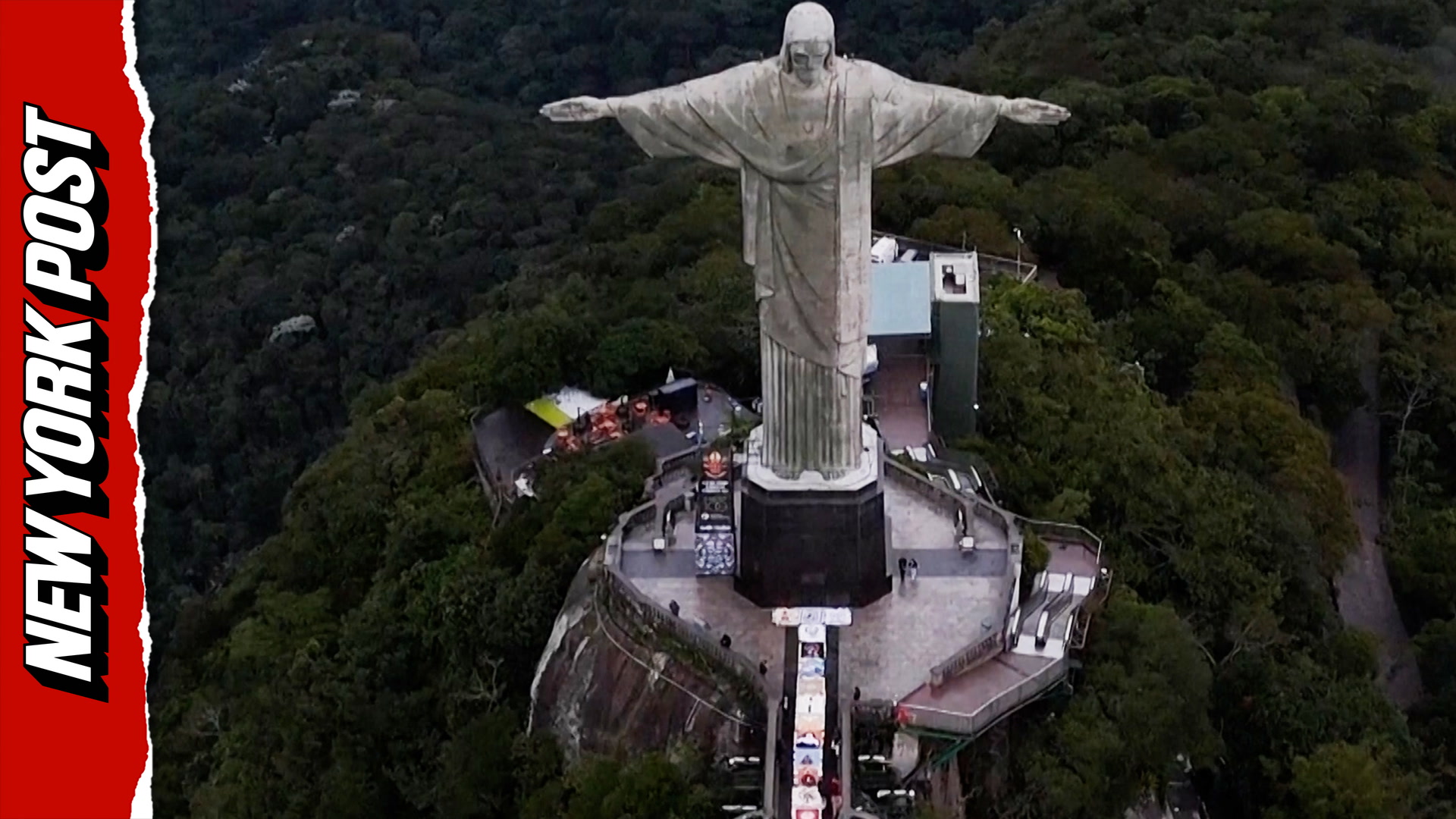 Beautiful intricate rugs laid at foot of Christ the Redeemer