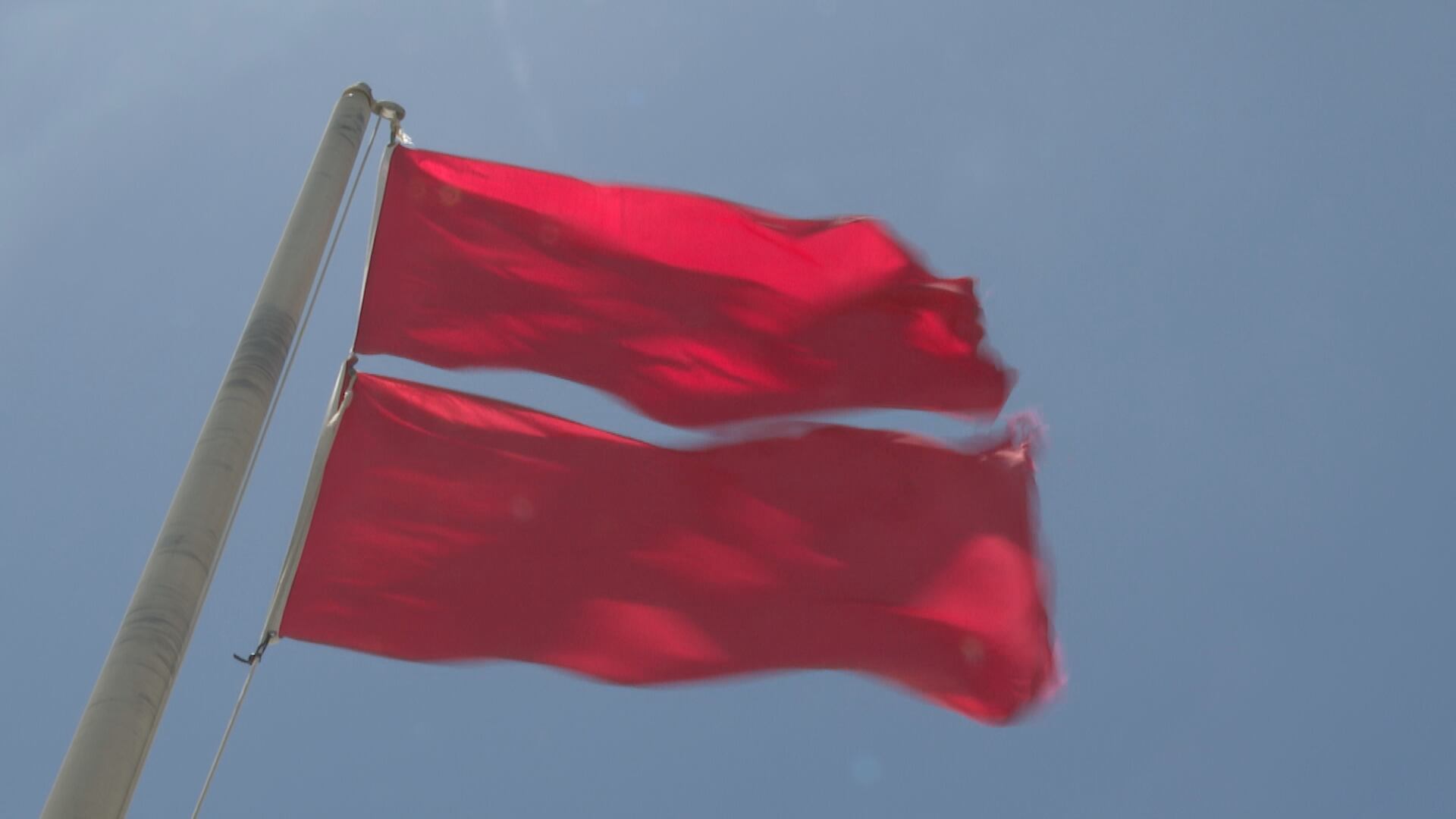 Double red flags keep beachgoers out of dangerous Gulf waters