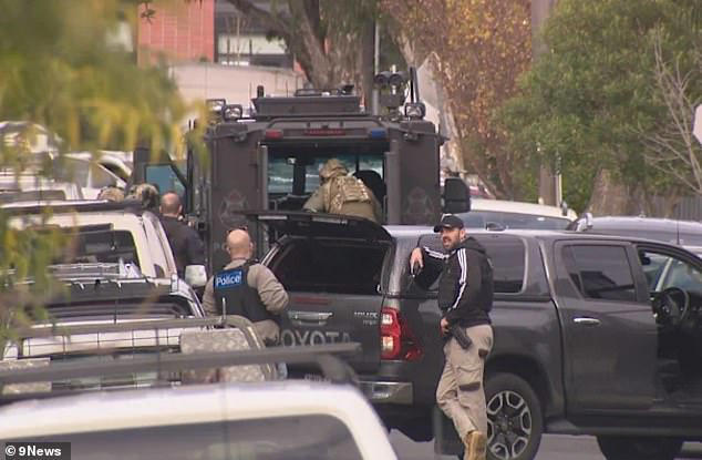 Stay inside warning issued as heavily armed police surround Melbourne ...