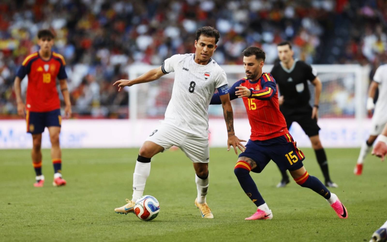 Second-string Spain held by Iraq in low-key World Cup send-off