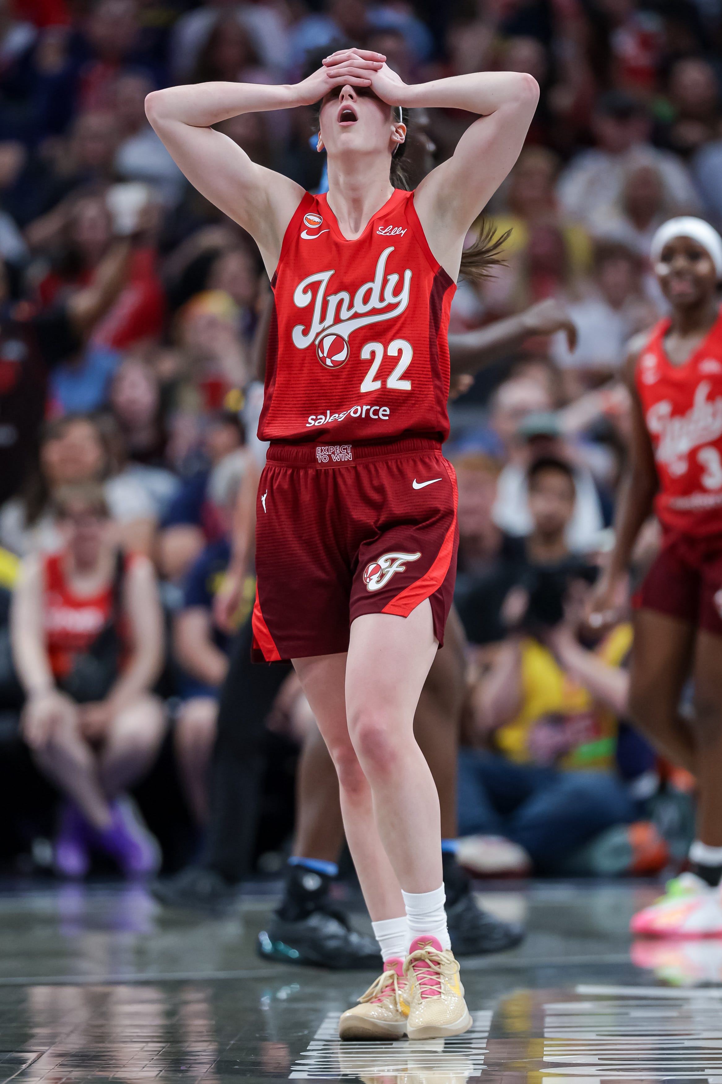 Fever's Caitlin Clark keeps playing after throwing up near bench ...