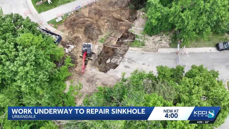 Crews are repairing a massive sinkhole in Urbandale