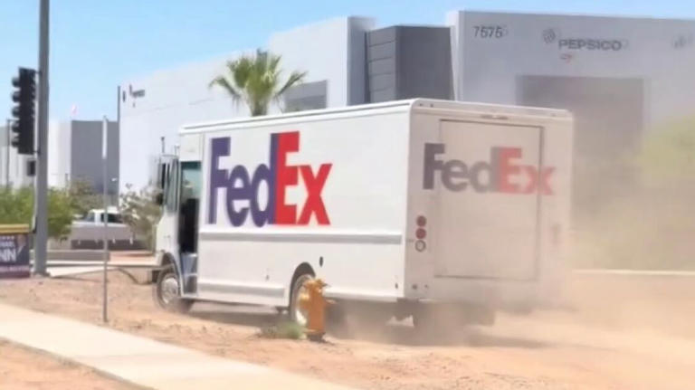 FedEx driver caught on video driving on sidewalk, running red light in ...