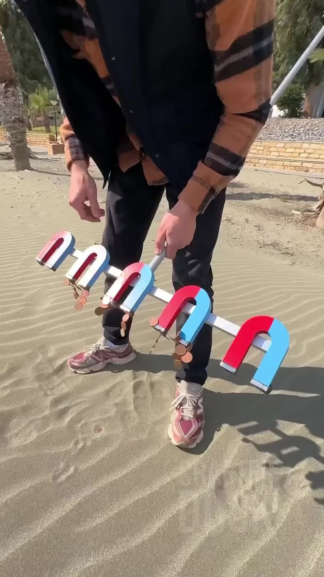 Magnetic rake uncovers lost treasures on the beach