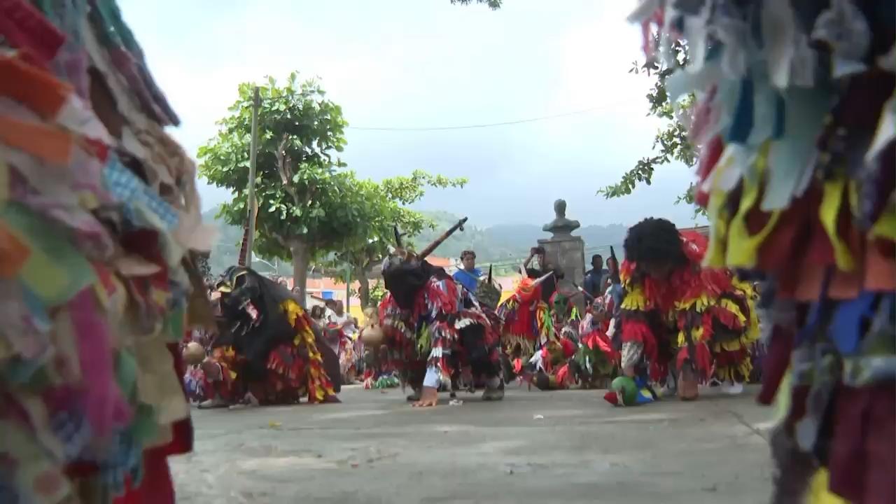 'Dancing Devils' chase children to their first communion in Venezuela
