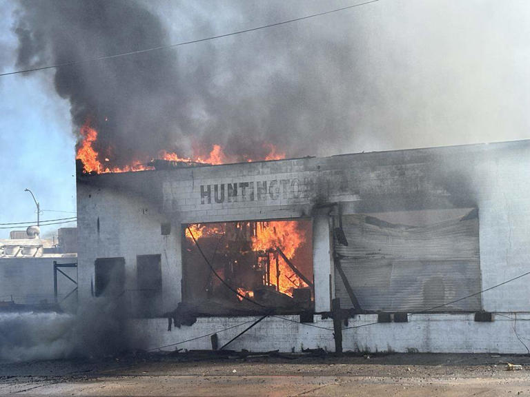 Two-alarm warehouse fire sends black smoke visible for miles near ...