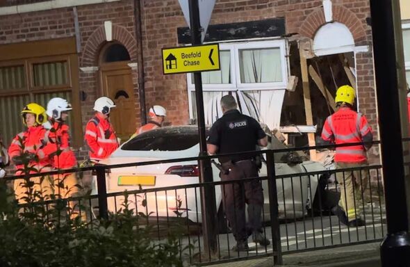 Carnage as Tesla crashes into house in UK town as 999 crews rush to scene