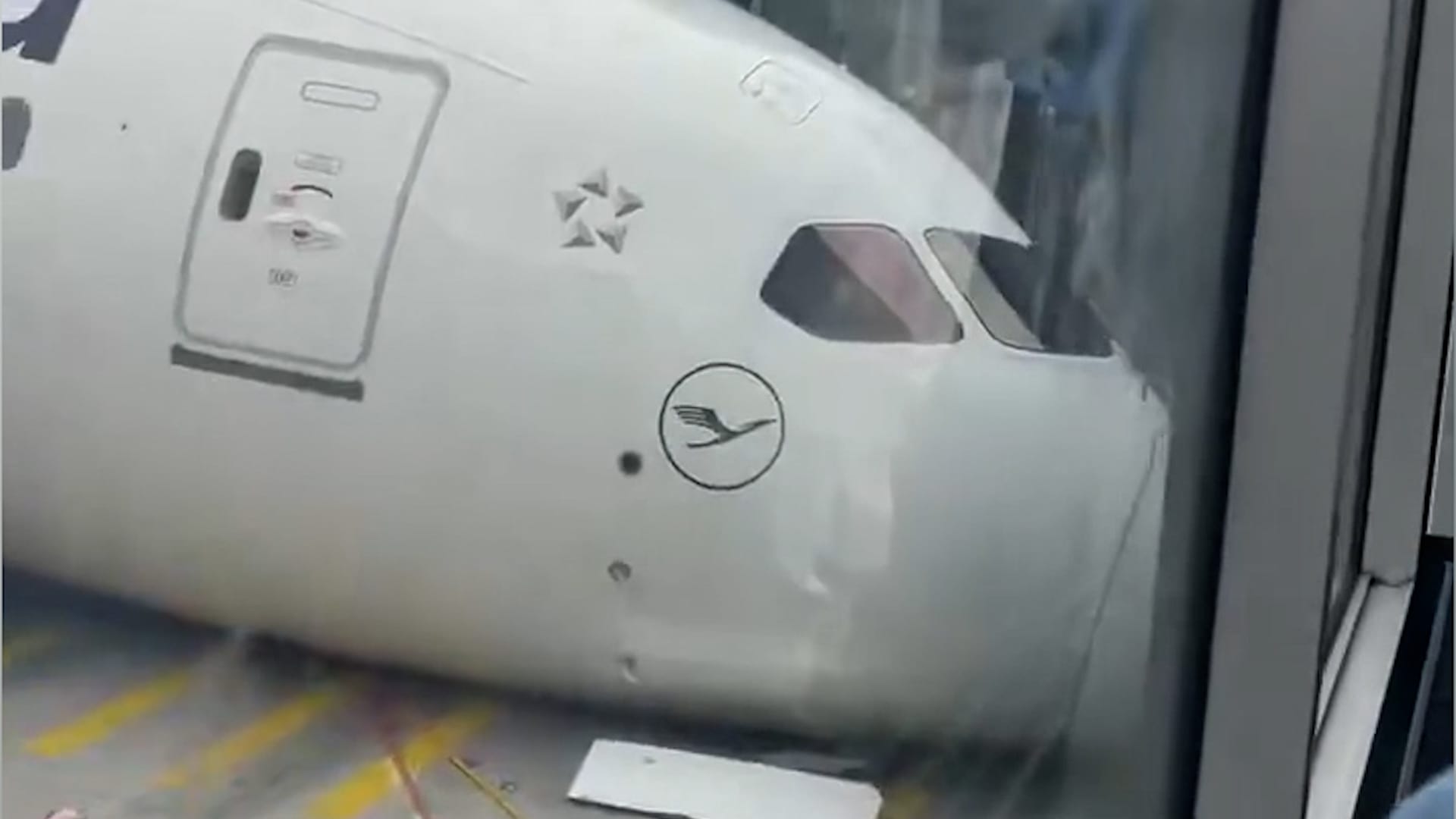 Aircraft seen resting on nose after landing gear failure