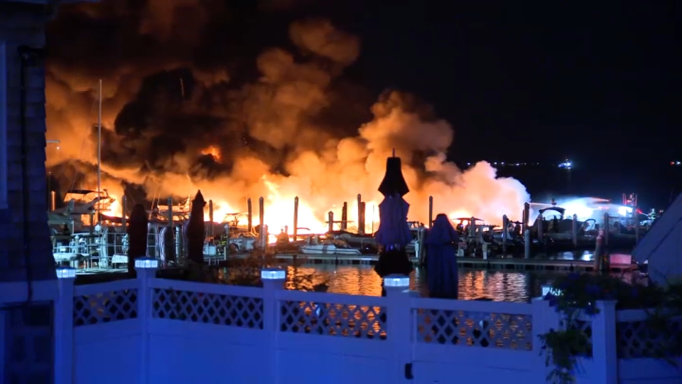 Massive fire burns a dozen boats at Winthrop yacht club