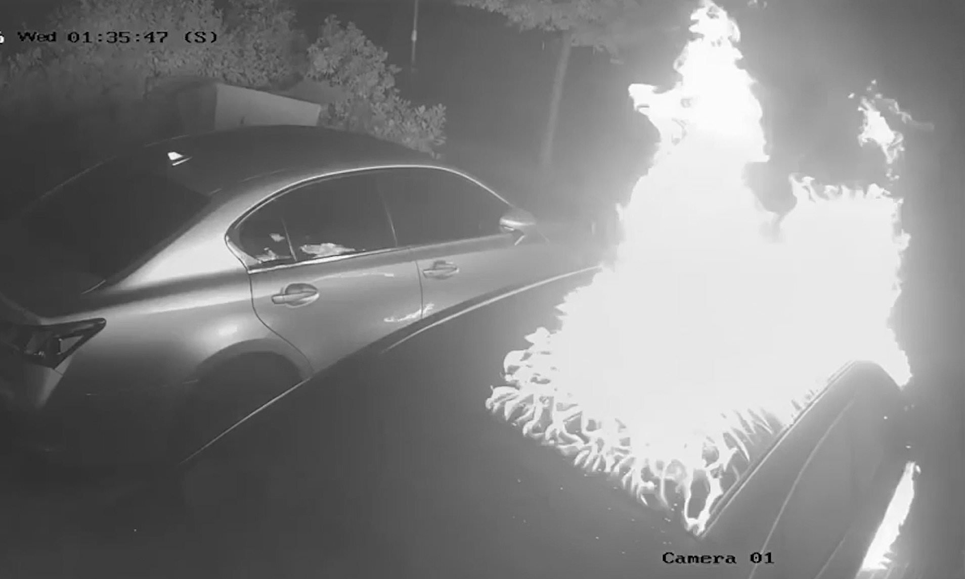 Moment arsonists set fire to car at family home of left-wing politician ...